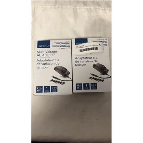 2 Insignia Multi Voltage Adapters
