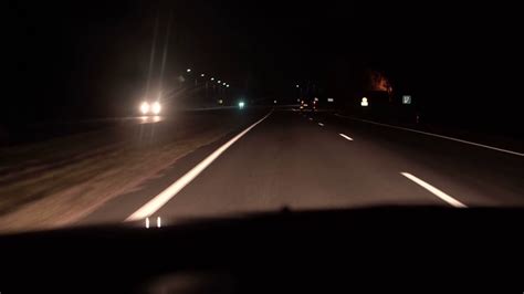 Night Road View From Inside A Car The Headlight And Other Car In