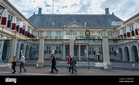 Tourists In Front Of The Royal Noordeinde Palace Official Working