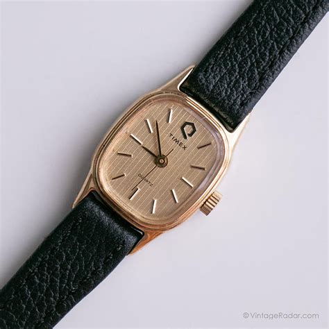 Tiny Rectangular Timex Ladies Watch With Champagne Dial And Black Strap