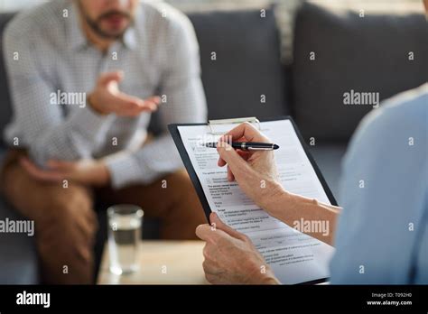 Putting Tick In Document Stock Photo Alamy