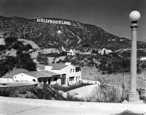 View Of The Hollywoodland Sign With Few Homes In The Foothills Below