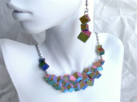 geometric cubic statement necklace and earrings by penolopybulnick