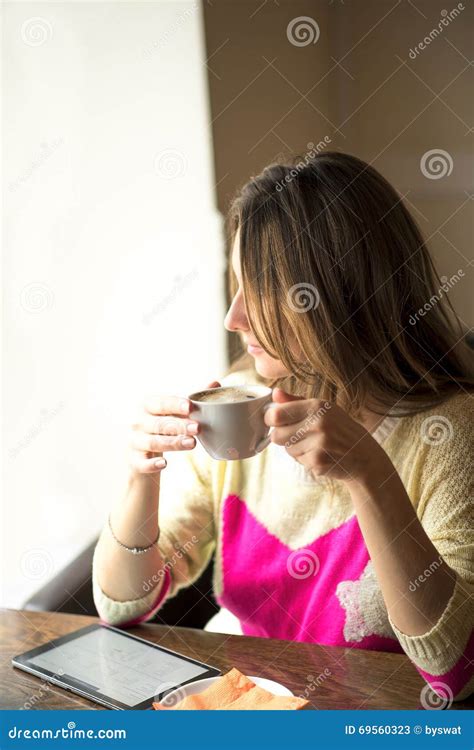 Young Girl Sitting In A Cafe With Cup Of Coffee Stock Image Image Of