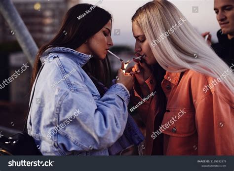 Two Teenage Girls Lighting Cigarettes Smoking Stock Photo Shutterstock