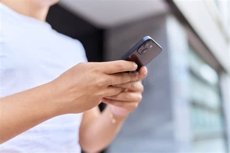 Non Binary Man Using Smartphone At Street Stock Image Image Of