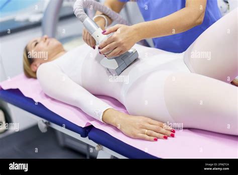 Woman In Special Suit Having A Anti Cellulite Belly Massage With Spa