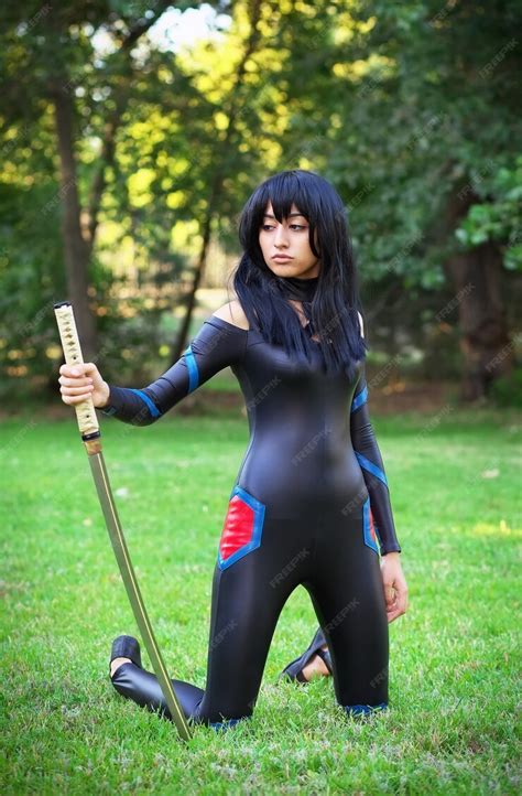 Premium Photo Young Girl Holding Samurai Sword Original Cosplay