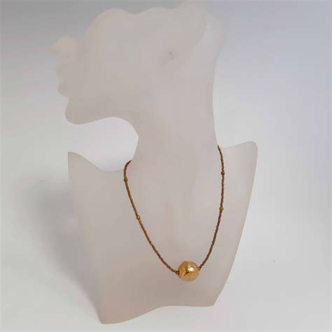 Pakabukas „auksinis Rutuliukas“