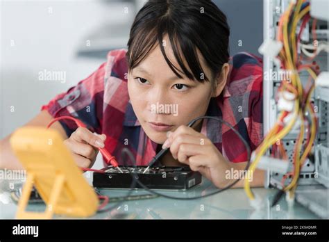 Technician Using Multimeter To Test Computer Component Stock Photo Alamy