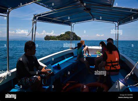 Boating To The Island Of Mamutik In The Tunku Abdul Rahman Park Near