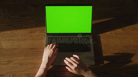 Top View Of A Woman Hand Scroll On A Laptop Computer Touchpad With Green Screen Chroma Key Stock