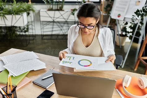 A Young Woman Focuses On Analyzing Stock Image Image Of Industry