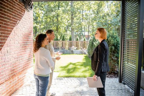 Redhead Realtor In Glasses Talking With Stock Image Image Of Shadows Exterior 233824651