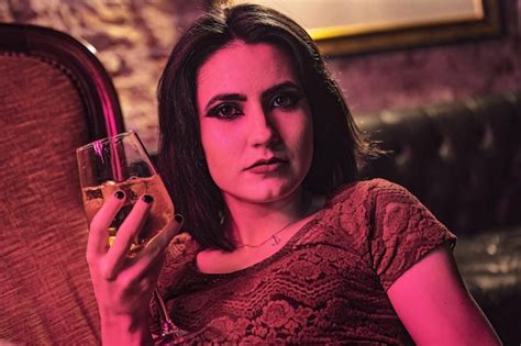 Premium Photo Seductive Rebel Brunette Girl Holding A Drink With A