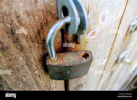 Open A Padlock With Traces Of Rust Hanging On The Door Stock Photo Alamy