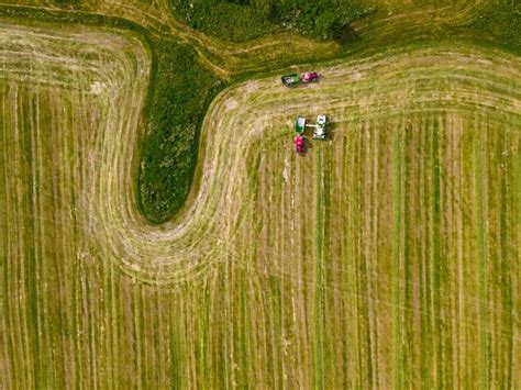 Premium Photo Tractor Mowing Agricultural Field Aerial View Cultivating Field