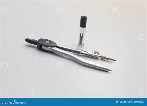 Compass For Sketching And Eraser On White Paper Stock Image