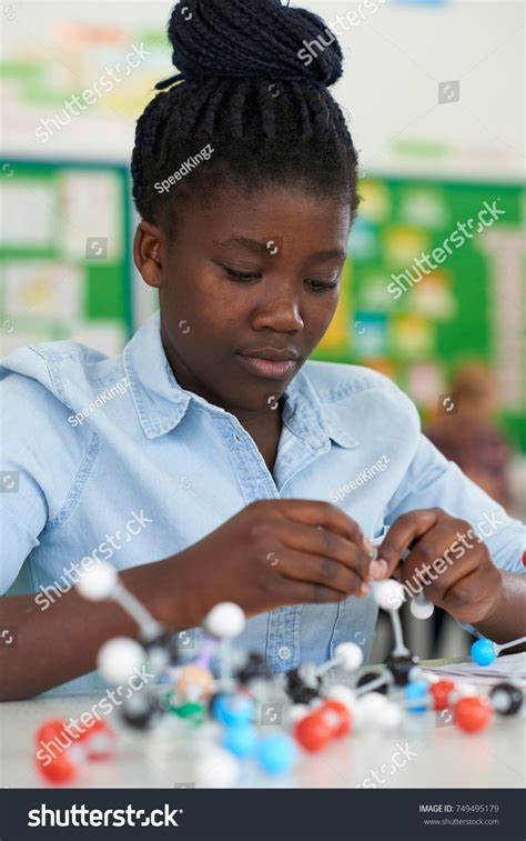 Female Pupil Using Molecular Model Kit In Science Lesson Ad Ad