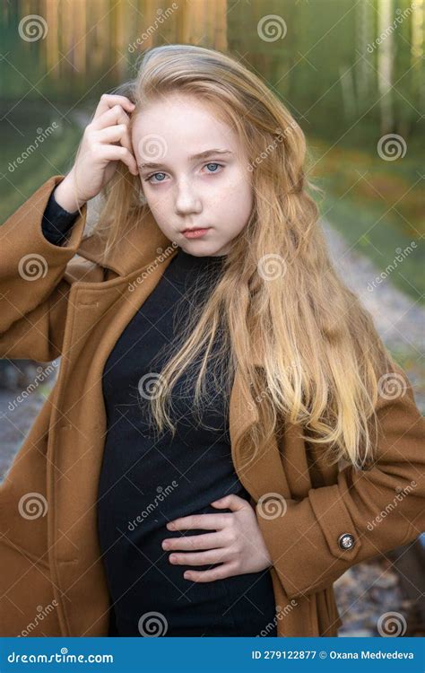 Close Up Portrait Of A Romantic 13 15 Year Old Girl In The Woods A Girl With Long Blond Hair