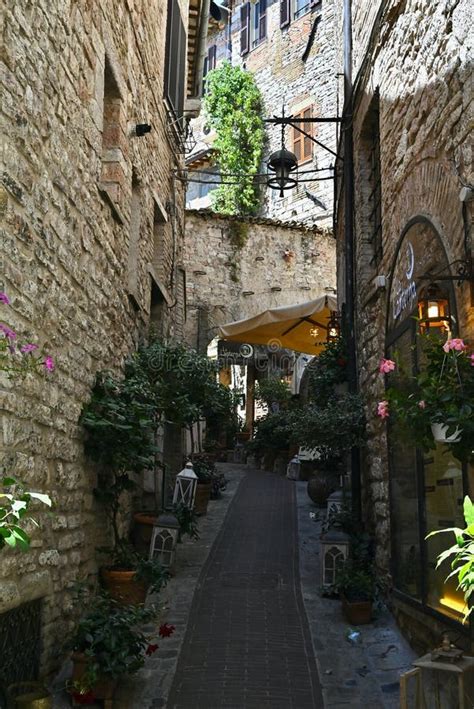 A Narrow Alley Between Old Medieval Buildings In Assisi Italy Stock