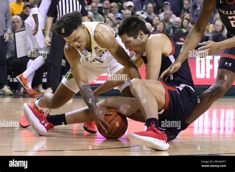 Baylor Guard Keyonte George Left Battles Texas Tech Forward Daniel Batcho Right For A Loose