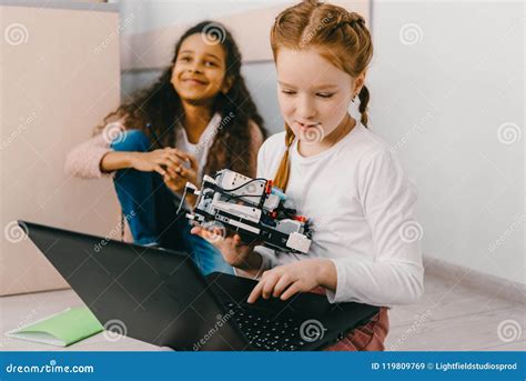 Teen Schoolgirls Programming Robot While Sitting Stock Image Image Of