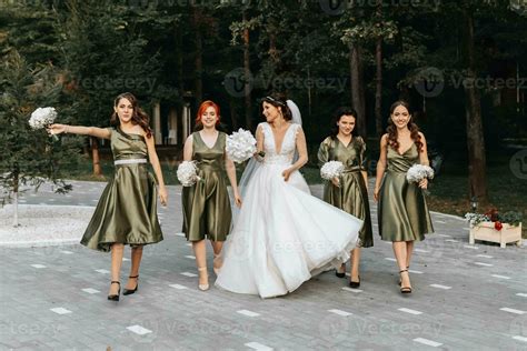 Beautiful Bride And Her Friends Bridesmaids Having Fun After Wedding
