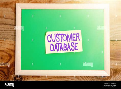 Hand Writing Sign Customer Database Word Written On Uptodate On Customer Information Records