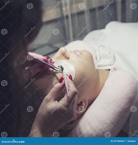 Woman Master In Salon Making Eyelash Extension Stock Image Image Of