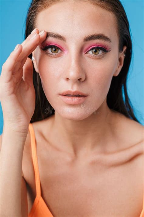Alluring Beautiful Female Model Applying Powder Puff For Facial Makeup