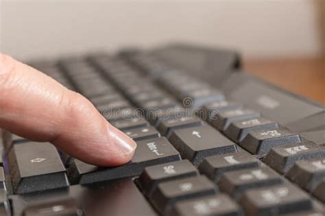 Index Finger Pressing The Enter Key On A Black Computer Keyboard Stock Image Image Of Hand