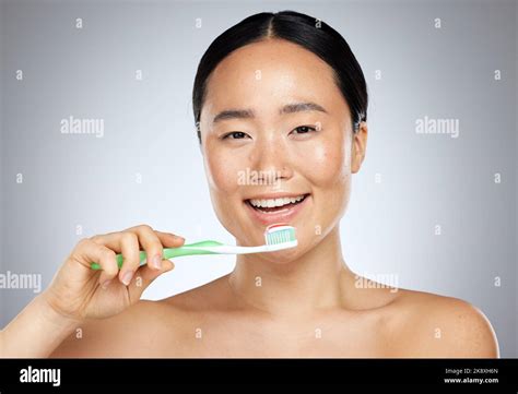 Brushing Teeth Asian Woman Beauty And Dental Wellness Health And