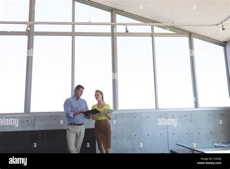 Male And Female Architects Interacting With Each Other In The Office Stock Photo Alamy