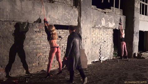 Sex Slaves Giving Their Bdsm Handler A Double Blowjob After A Whipping
