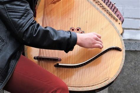 Premium Photo Side View Midsection Of Person Playing String Instrument