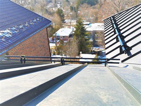 Installed Snow Guards On Standing Seam Metal Roof Of New Residential