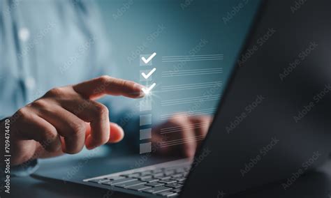 Businessman Marks Checkboxes The Survey Form Check Marks On A Checklist Fill Out Online Form