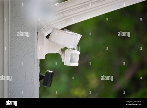 Motion Sensor With Light Detector Mounted On Exterior Wall Of Private House As Part Of Security