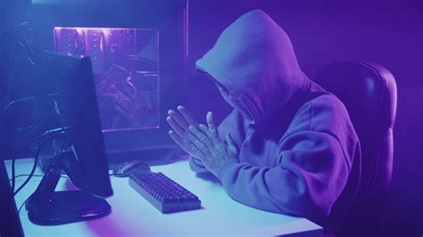 hacker in a hood works at a computer 27703822 stock video at vecteezy