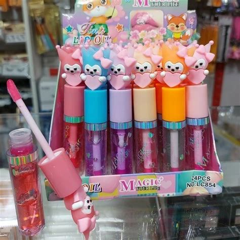 خرید و قیمت بالم لب مایع حرارتی سر عروسکی مجیک بالم حرارتی رنگ دار مجیک