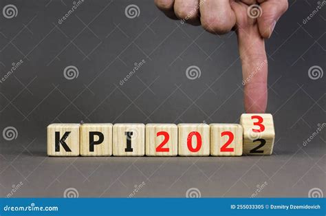 KPI Key Performance Indicator Symbol Businessman Turns Wooden Cubes With Words KPI And