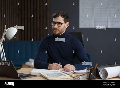 Architect Working In Office With Blueprints Engineer Inspect Architectural Plan Sketching A