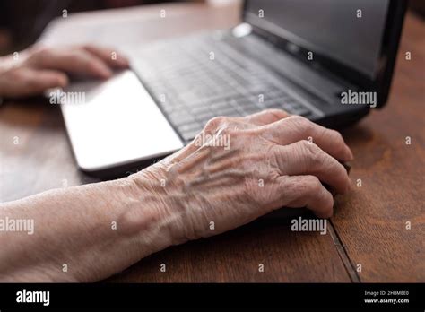 Old Woman Hand Using The Mouse Of A Computer Stock Photo Alamy