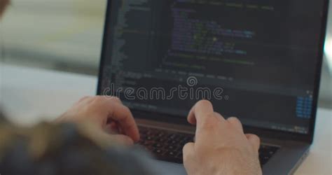 close up hands engineers developing software app using digital laptop computer typing code on