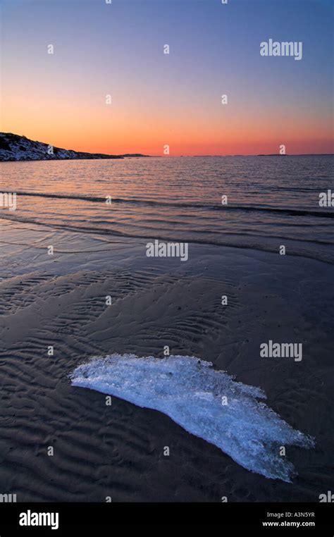 Ice Block Lying On Beach At Sunset Vallda Sandö Halland Sweden Stock
