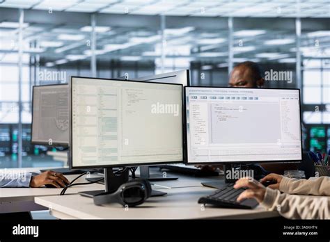 Lines Of Code Running On Computer Screens In Data Center Used By