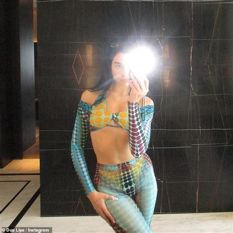 Dua Lipa Flashes A Glimpse Of Her Yellow Thong Under Graphic Print