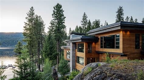 Cliff House In Idaho Steps Down A Granite Slope To A Lake