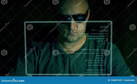 Fashion Man In Dark Glasses Sits In Front Of Virtual Screen And Typing Code On Computer